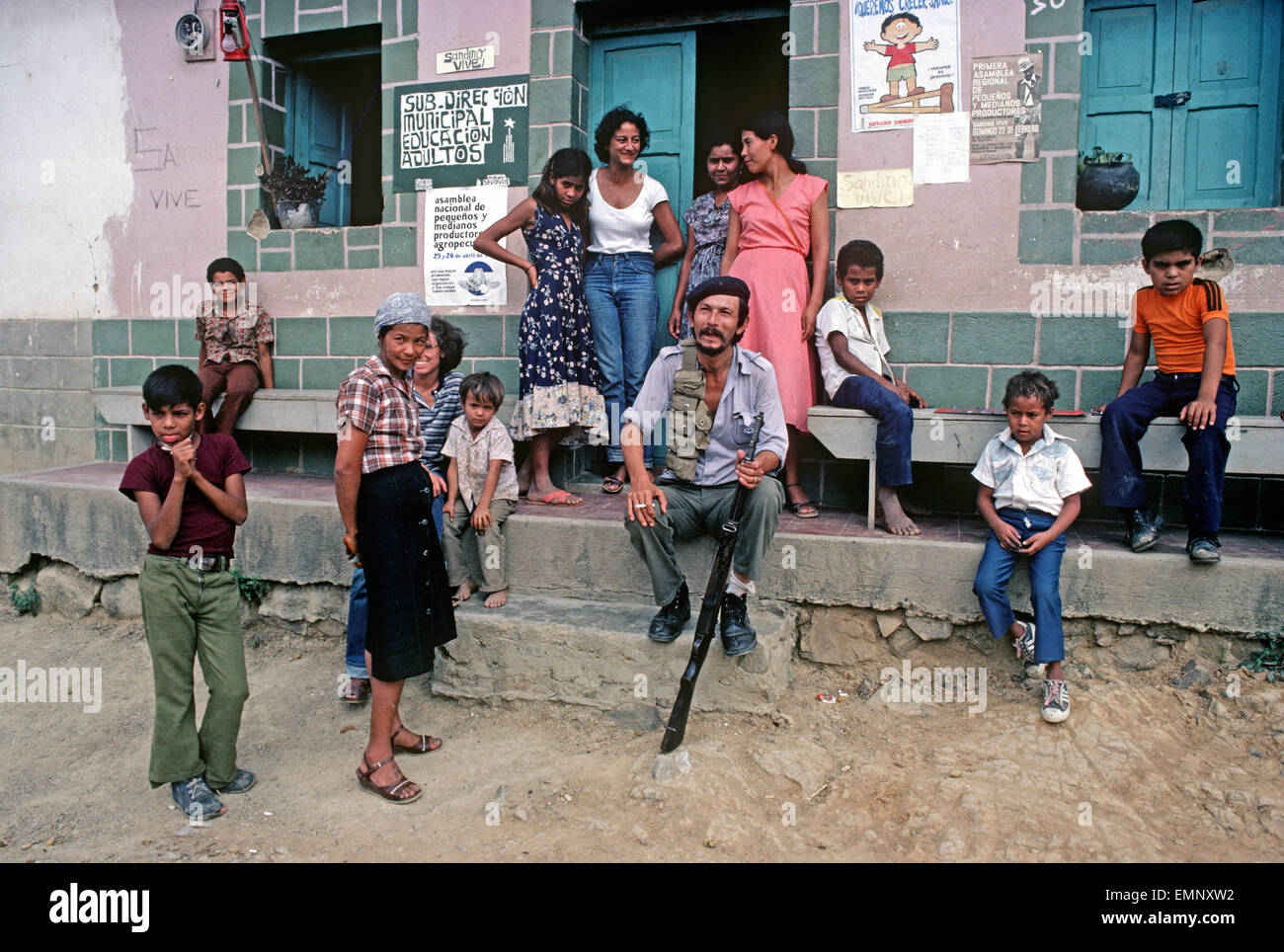 Local armed militia surrounded by Santa Maria villagers, a small ...