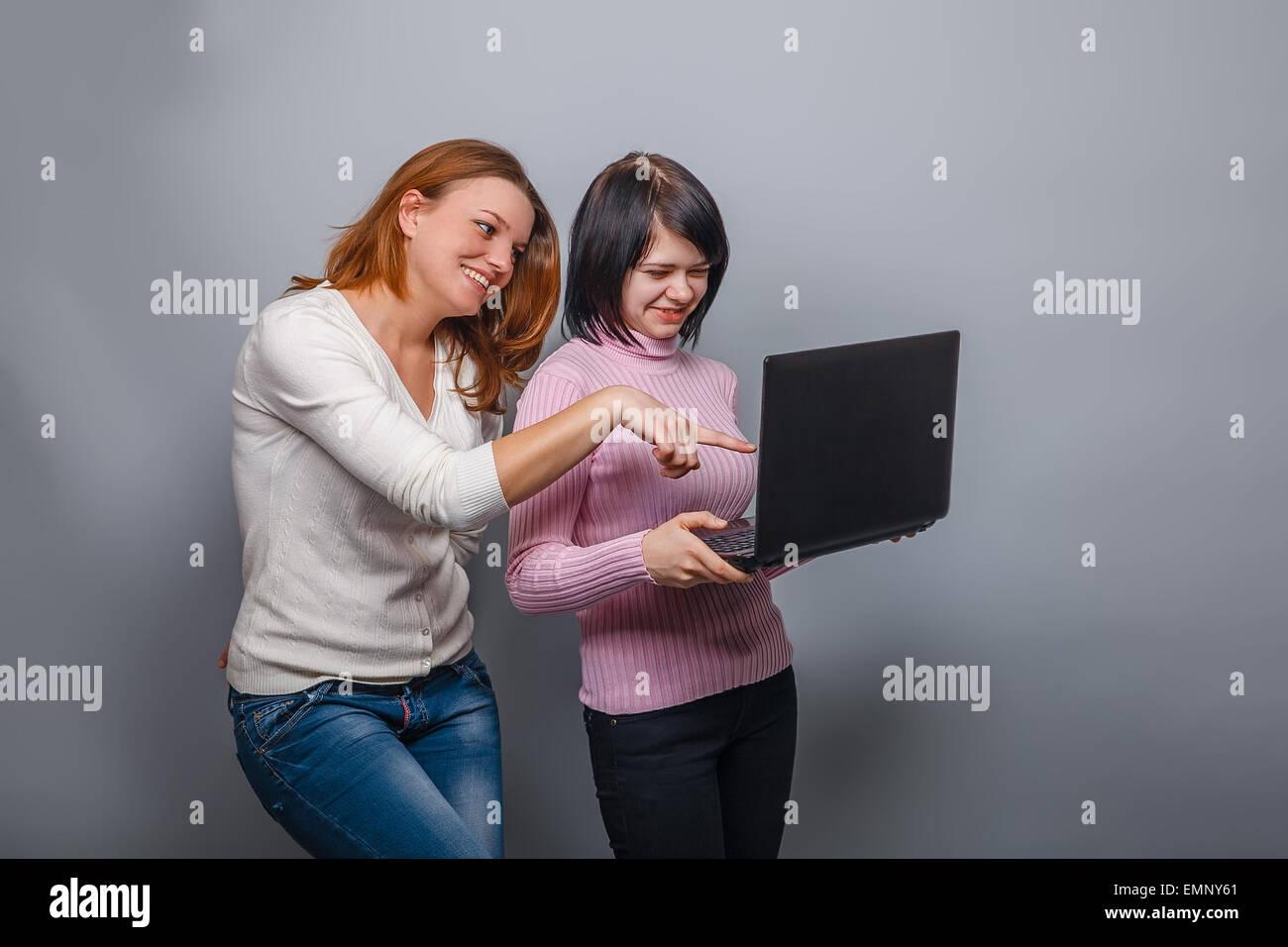 two girls European appearance girlfriend looking at the computer ...
