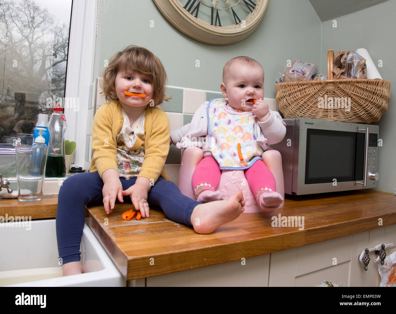 Baby sitting on kitchen counter hi-res stock photography and images - Alamy