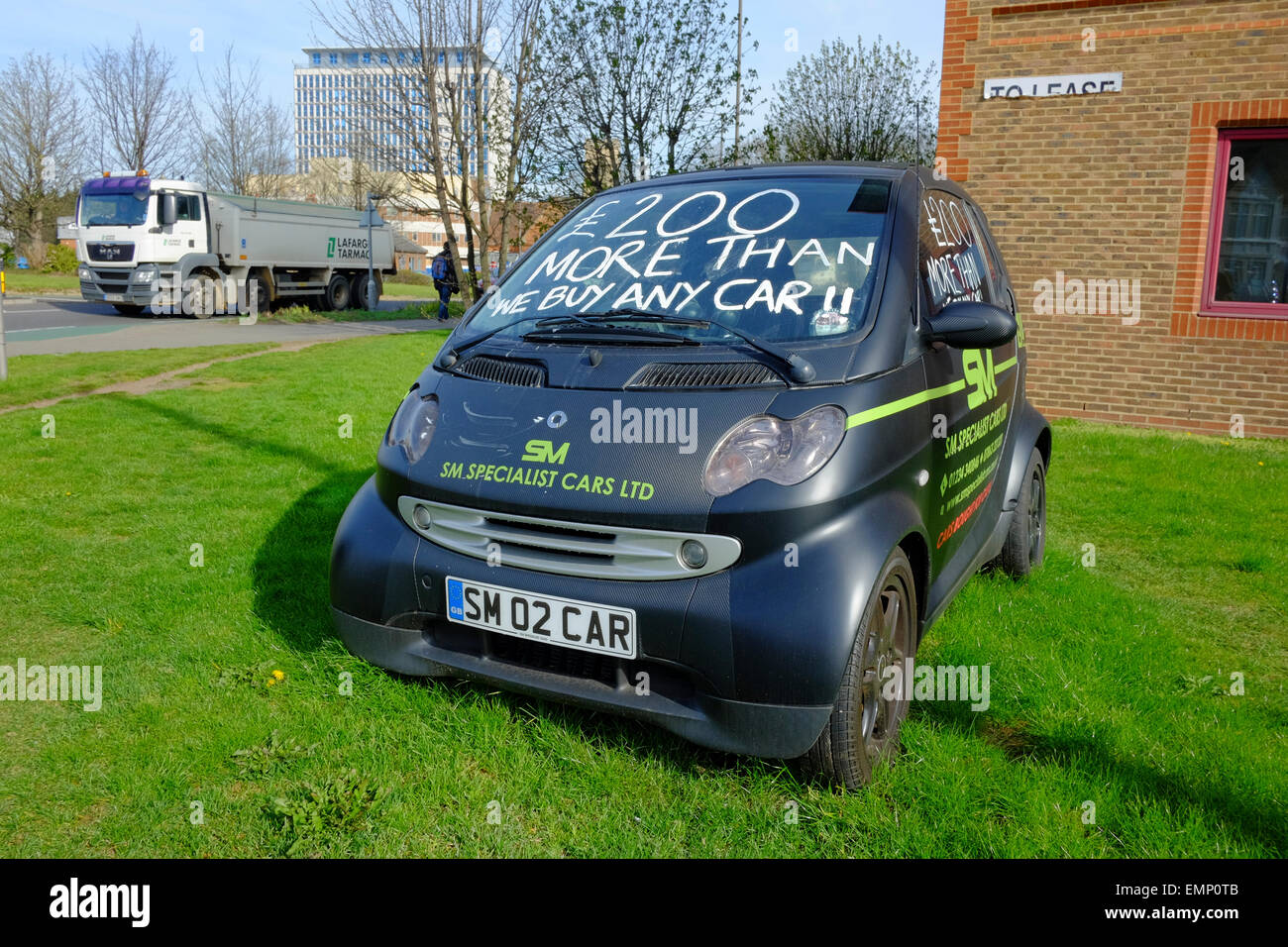 Smart Car with with lettering on windscreen "200 pound more than We by ...