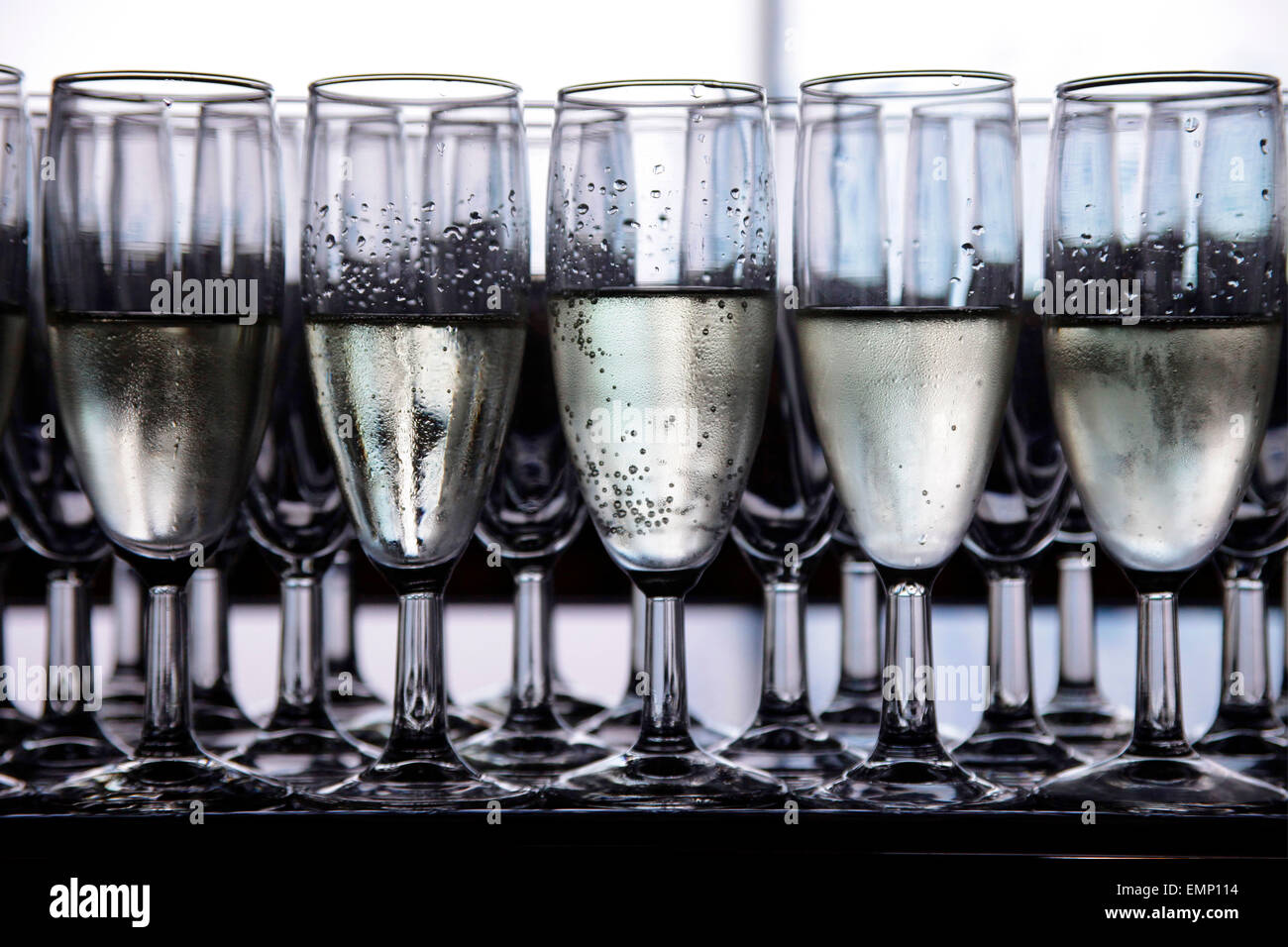 Cold flutes of cava champagne during an opening party Stock Photo - Alamy