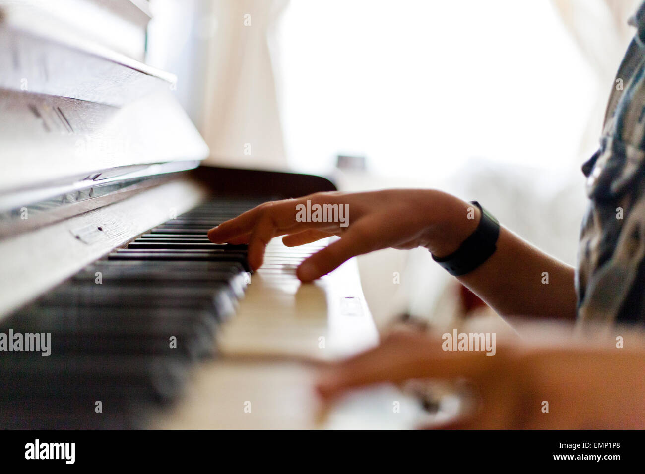 Boy playing musical instruments hi-res stock photography and images - Alamy