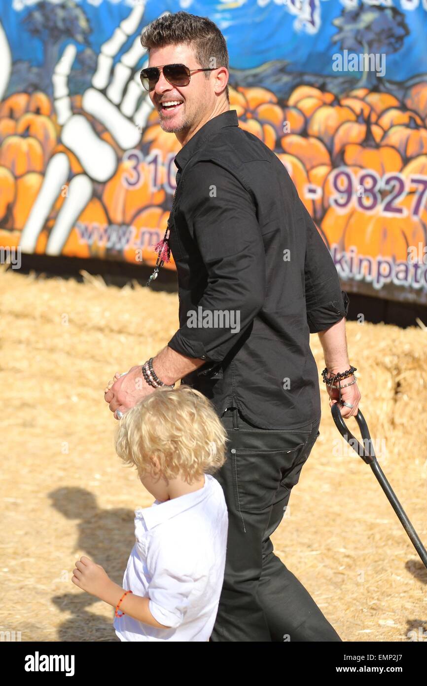 Robin Thicke arrives at Mr Bones pumpkin patch with his son. Featuring ...