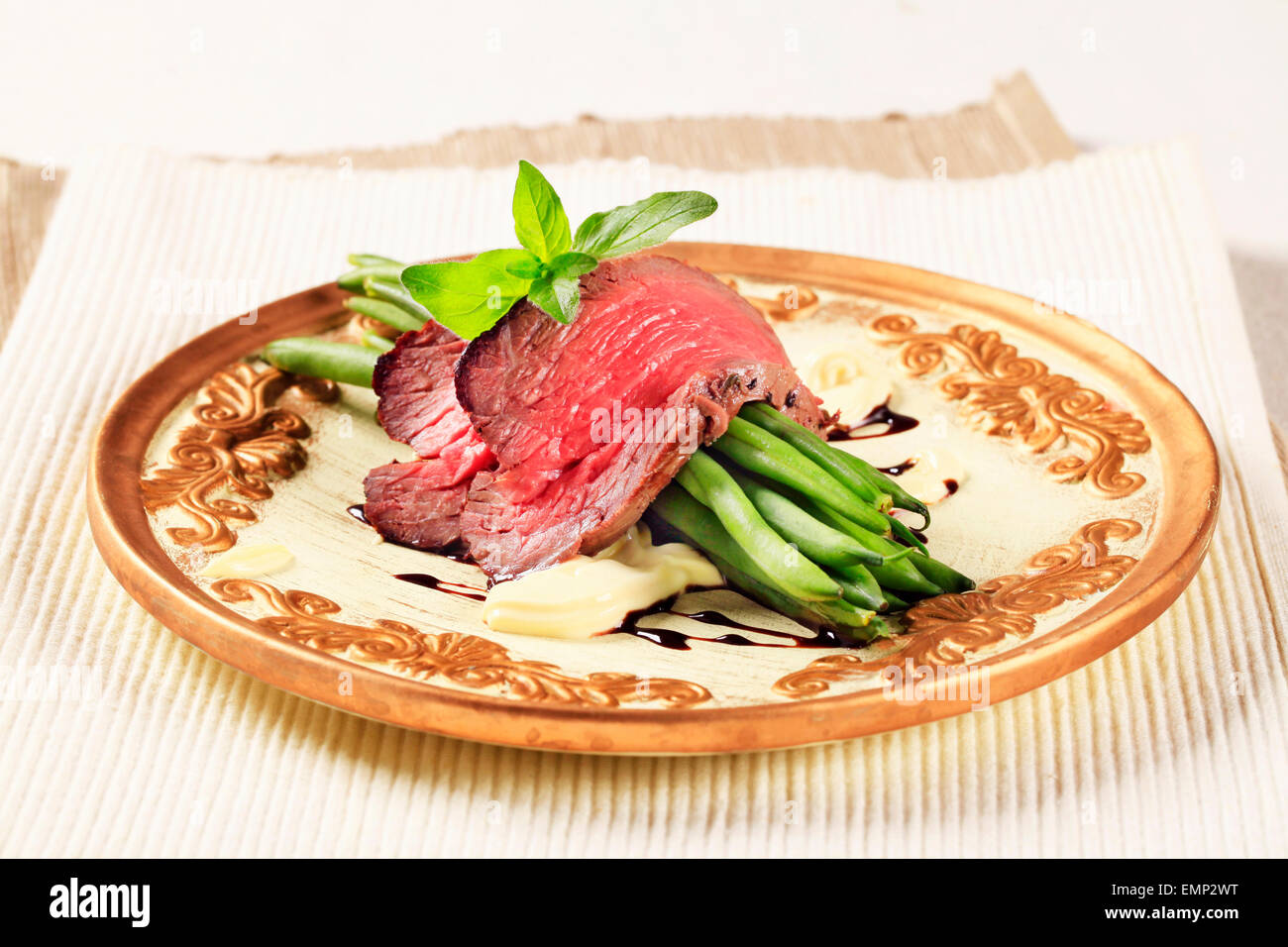 Slices of roast beef and string beans Stock Photo - Alamy