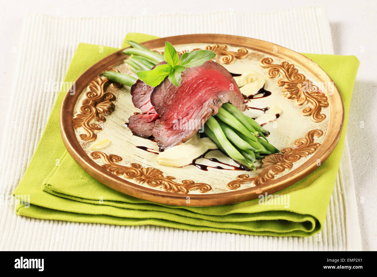 Slices of roast beef and string beans Stock Photo - Alamy