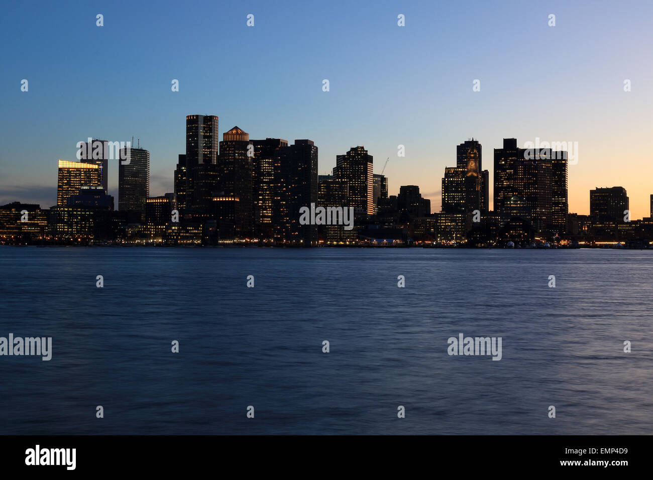 Boston skyline during sunset with beautiful sky colors reflected in ...