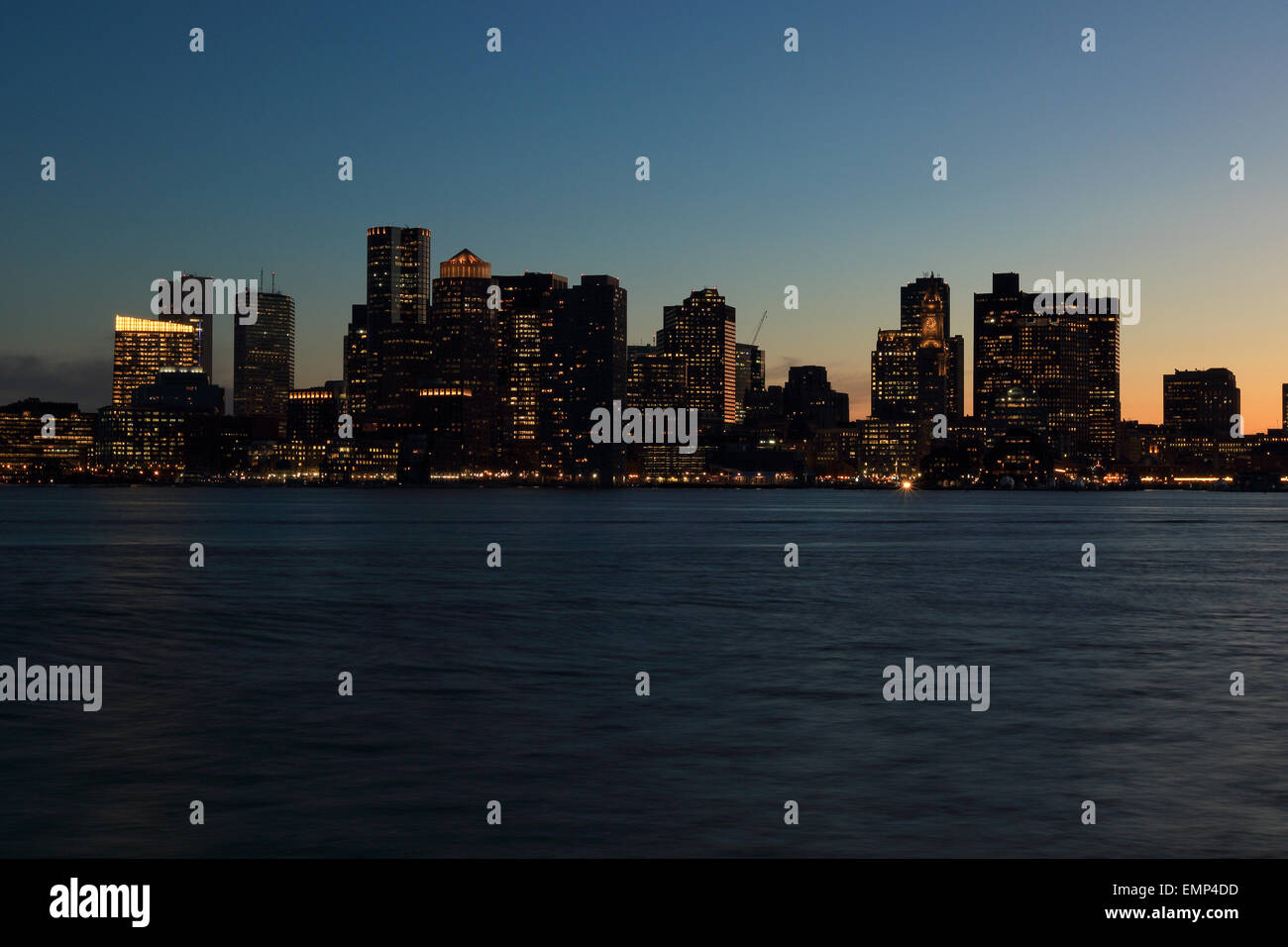 Boston skyline during sunset with beautiful sky colors reflected in ...