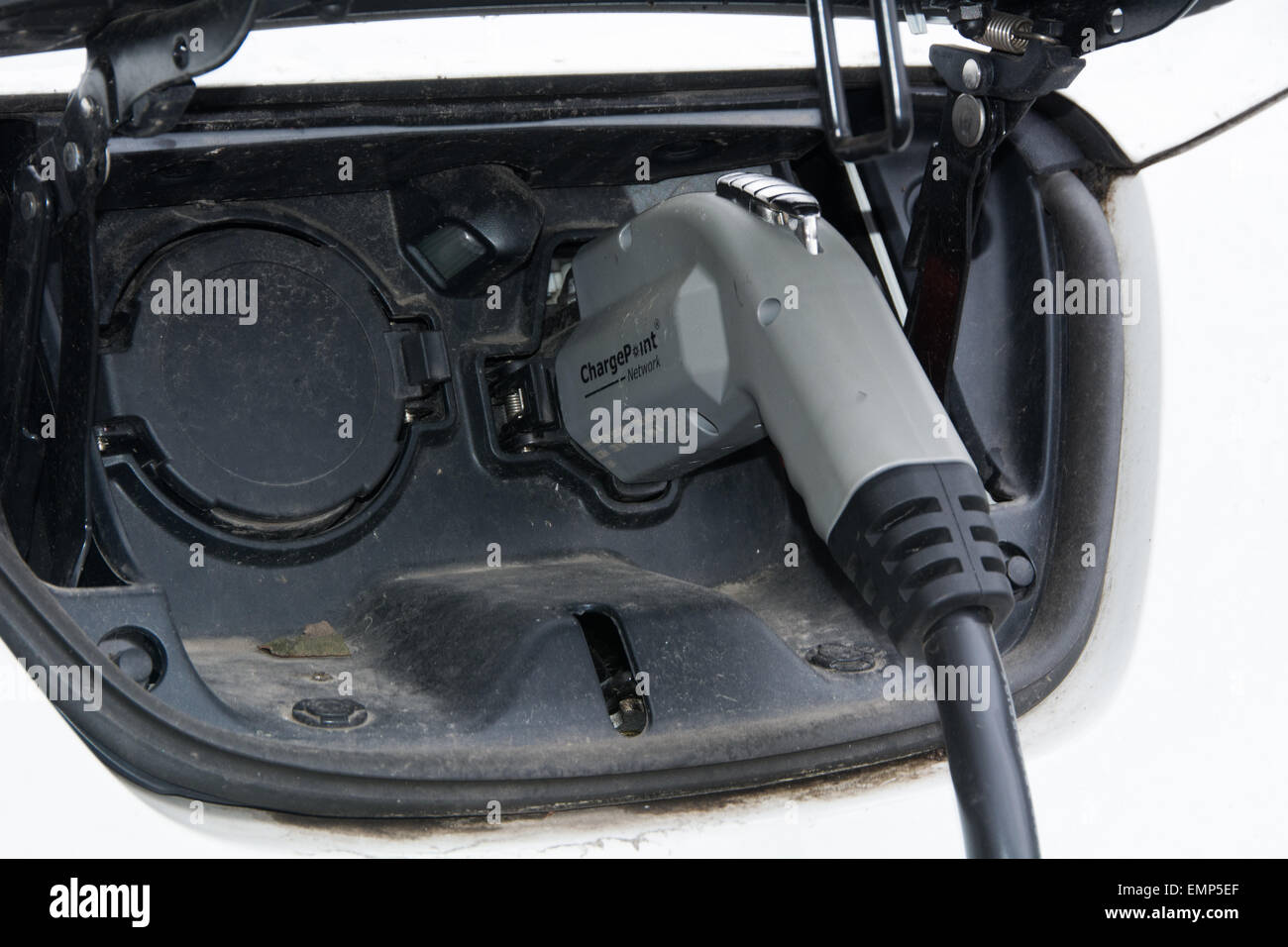 Electric vehicle charging port with external charger plugged in Stock ...