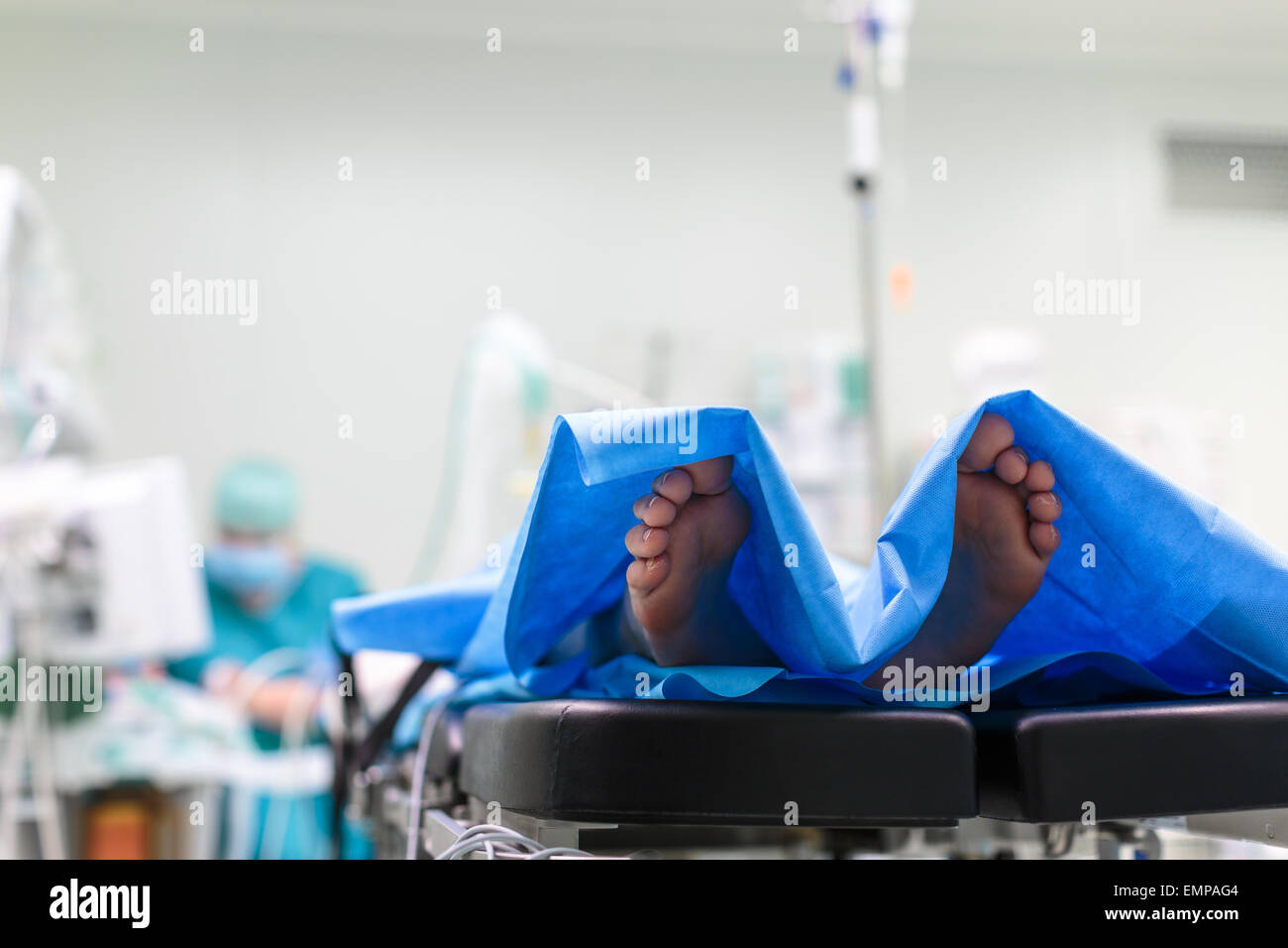 Feet of a patient ready for a surgery in a surgery room (color toned ...