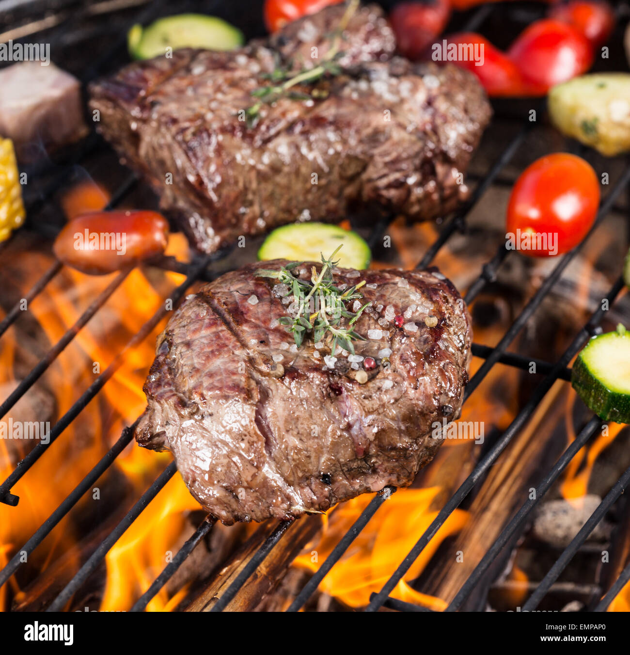 Beef steaks on grill Stock Photo - Alamy