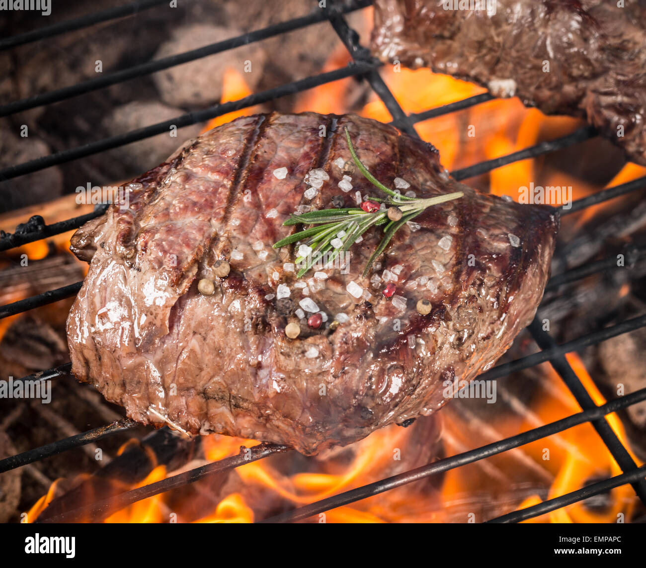 Beef steaks on grill Stock Photo - Alamy