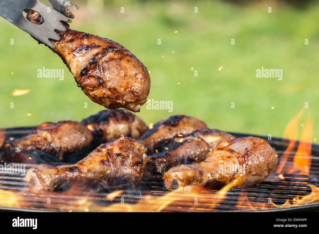 Chicken legs on grill Stock Photo - Alamy