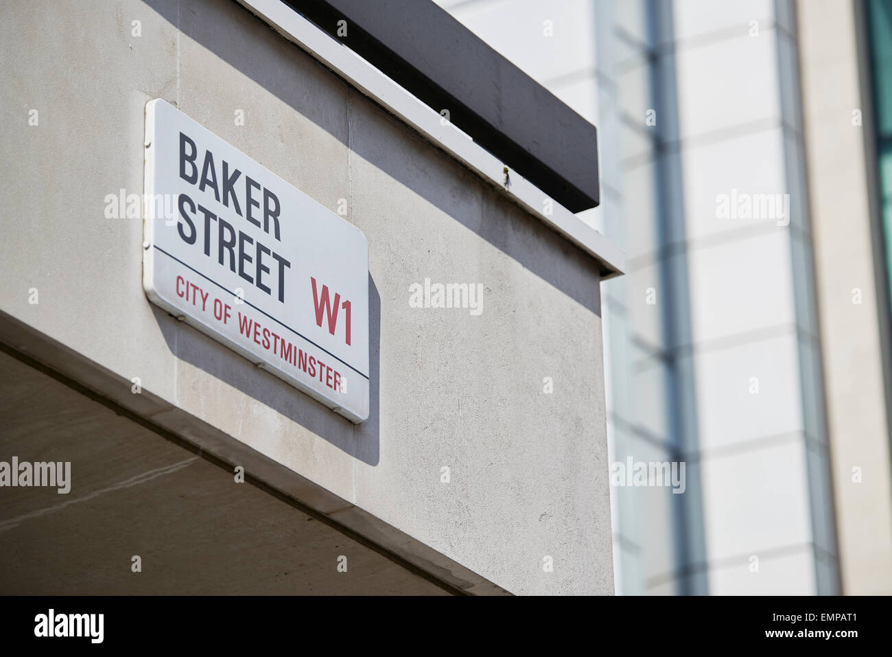 Detail of Baker Street sign on empty white building wall. Lots of copy ...