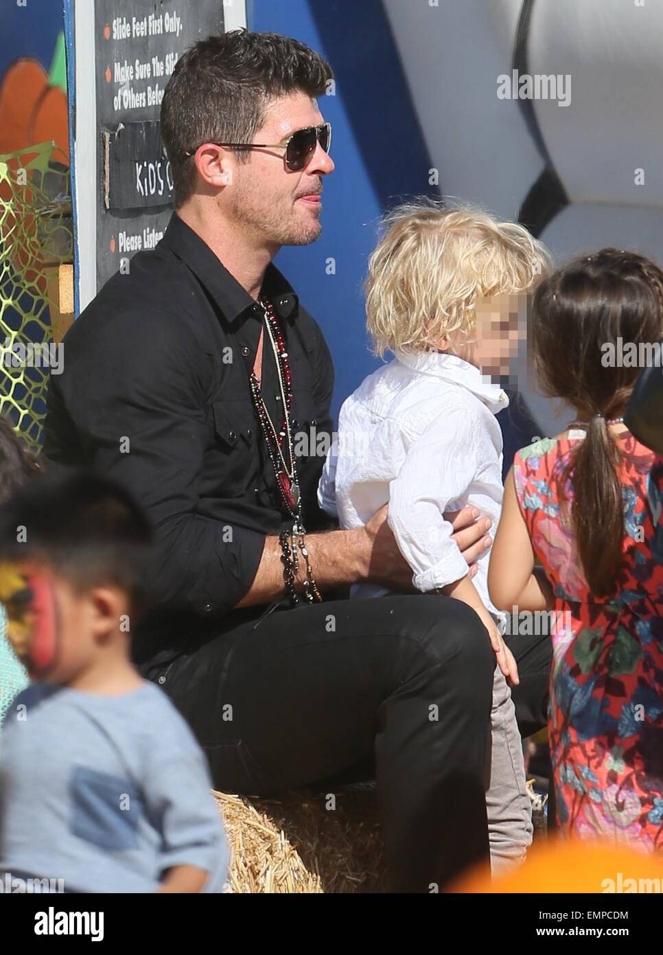 Robin Thicke visits Mr. Bones Pumpkin Patch with his son Julian ...