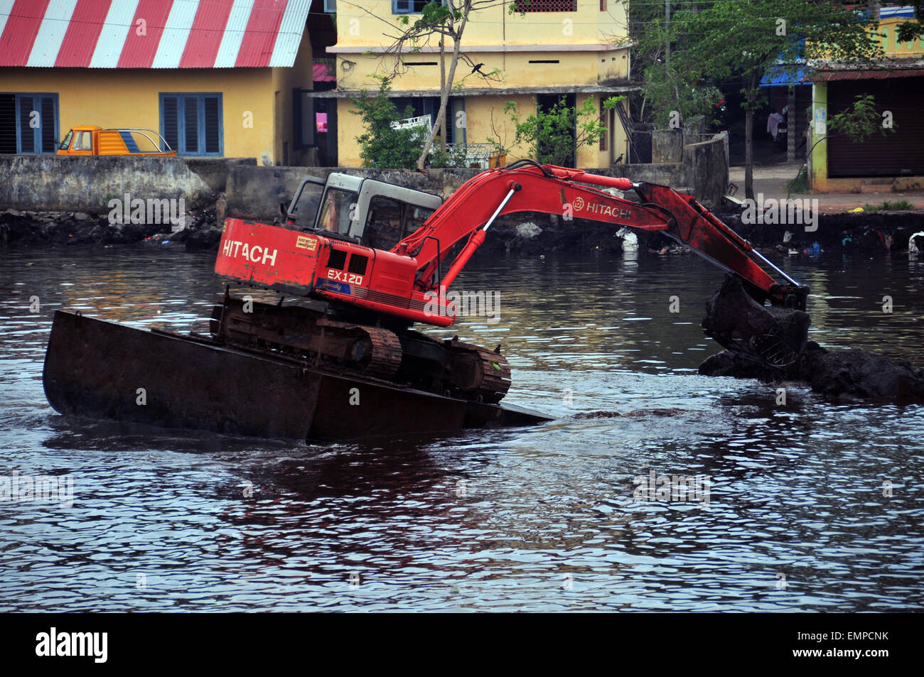 Bulldozer machine on water Stock Photo - Alamy