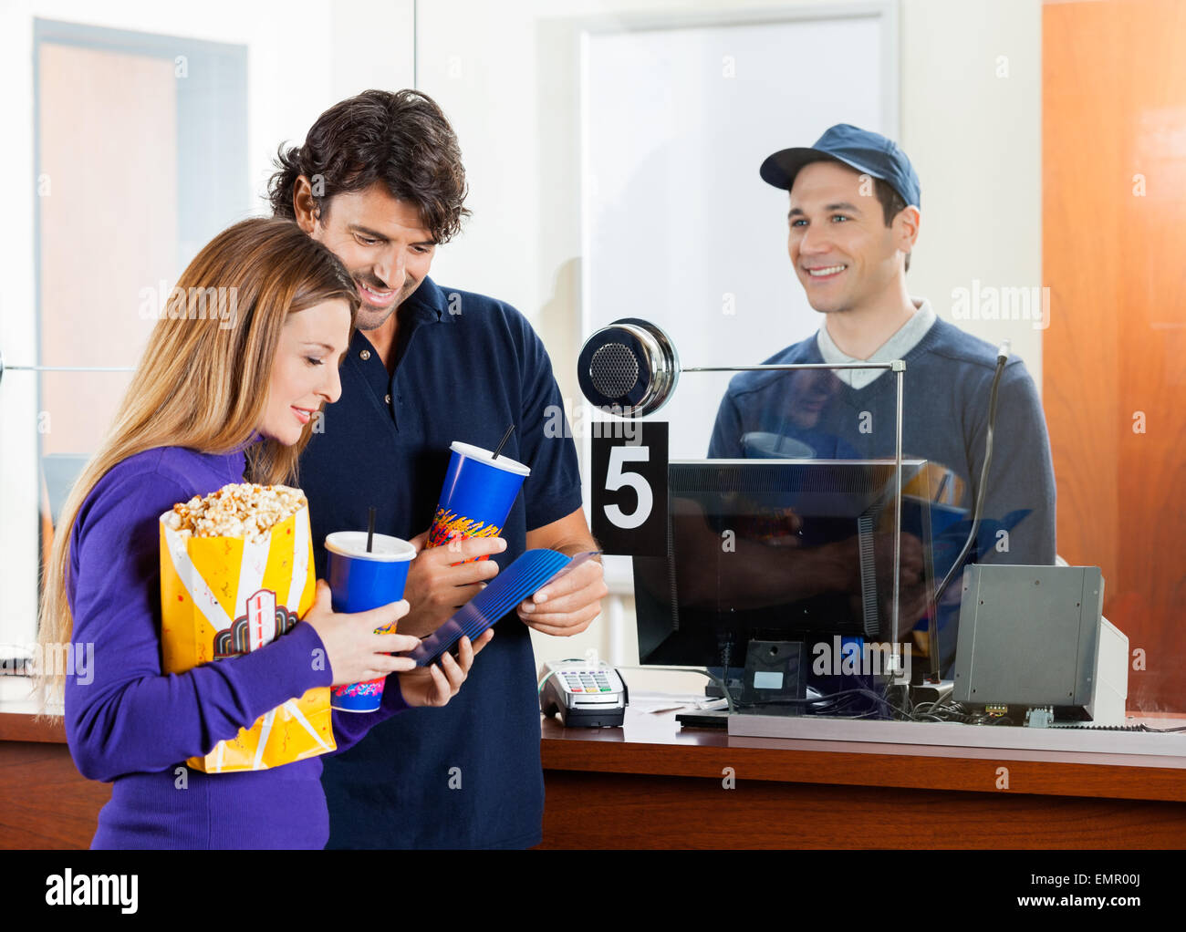 Cinema ticket buying popcorn hi-res stock photography and images - Alamy