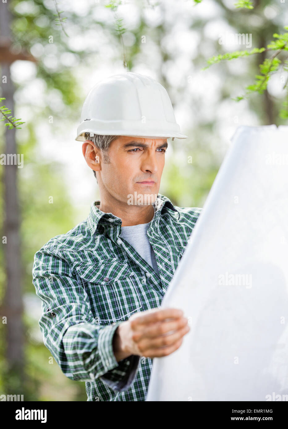 Male architect studying building plan hi-res stock photography and ...
