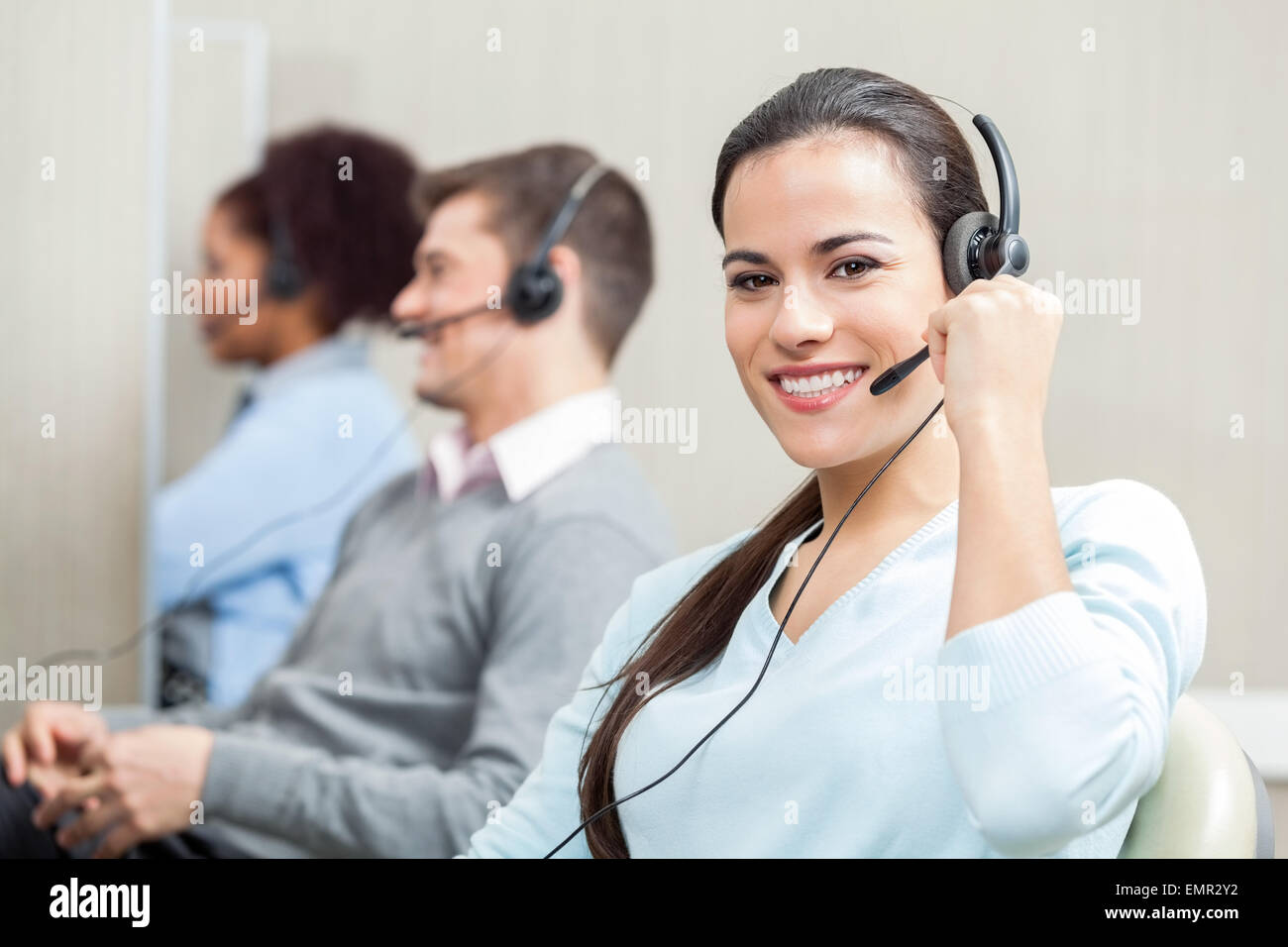 Smiling Female Customer Service Executive Working In Office Stock Photo ...