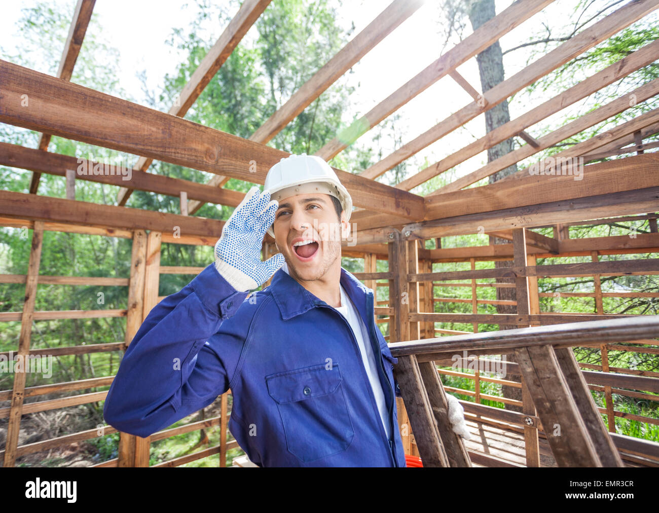 Worker Screaming While Carrying Ladder Stock Photo - Alamy