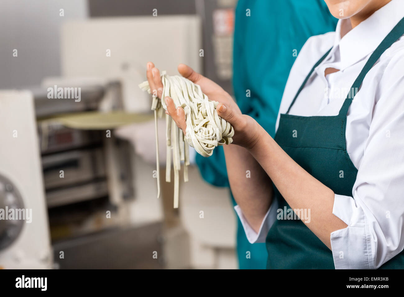 Chef Holding Fresh Spaghetti Pasta At Kitchen Stock Photo - Alamy