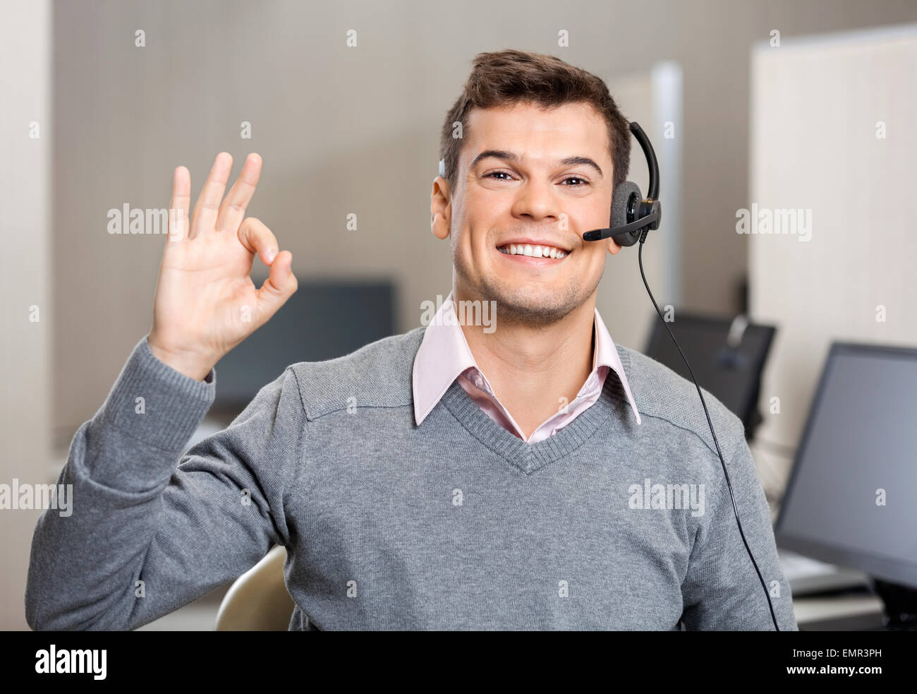 Customer Service Representative Showing Ok Sign Stock Photo - Alamy