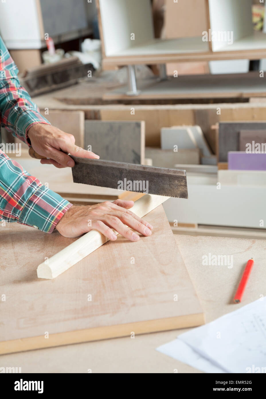 Carpenter's Hand Cutting Wood With Small Saw Stock Photo - Alamy
