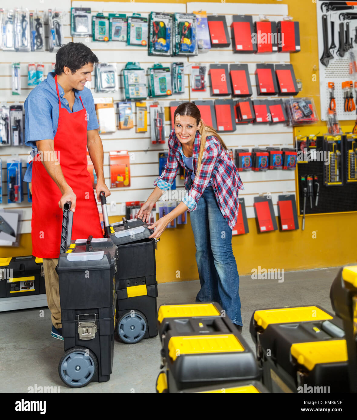 Woman Selecting Tool Cases In Hardware Store Stock Photo - Alamy