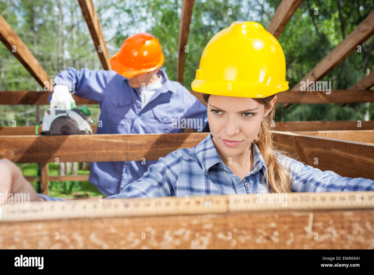 Architect Using Measure Tape At Construction Site Stock Photo - Alamy