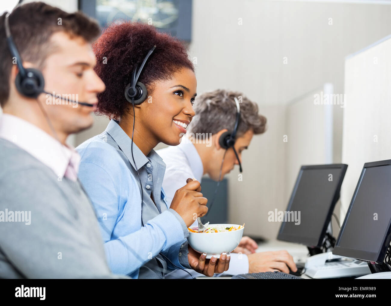 Girl eating food office hi-res stock photography and images - Alamy