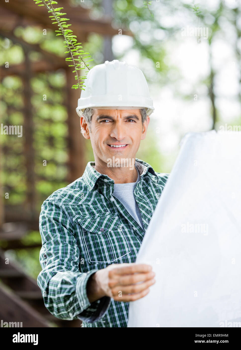 Architect holding blueprint hi-res stock photography and images - Alamy