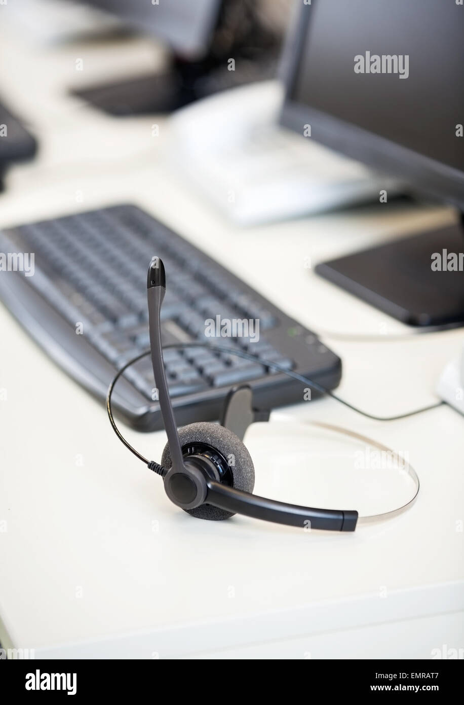Headset And Keyboard On Desk Stock Photo - Alamy