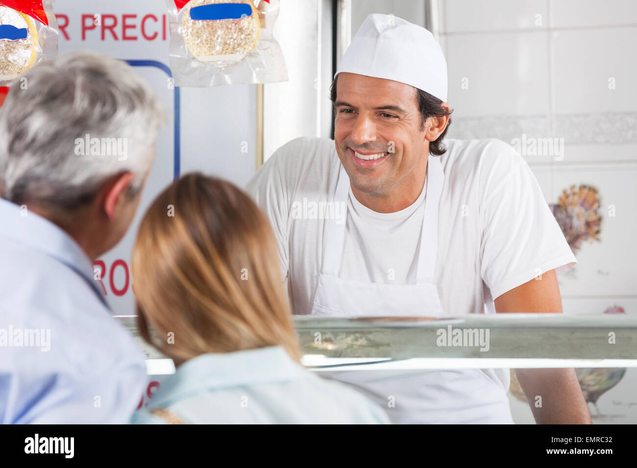 Friendly Butcher Smiling At Customers Stock Photo - Alamy
