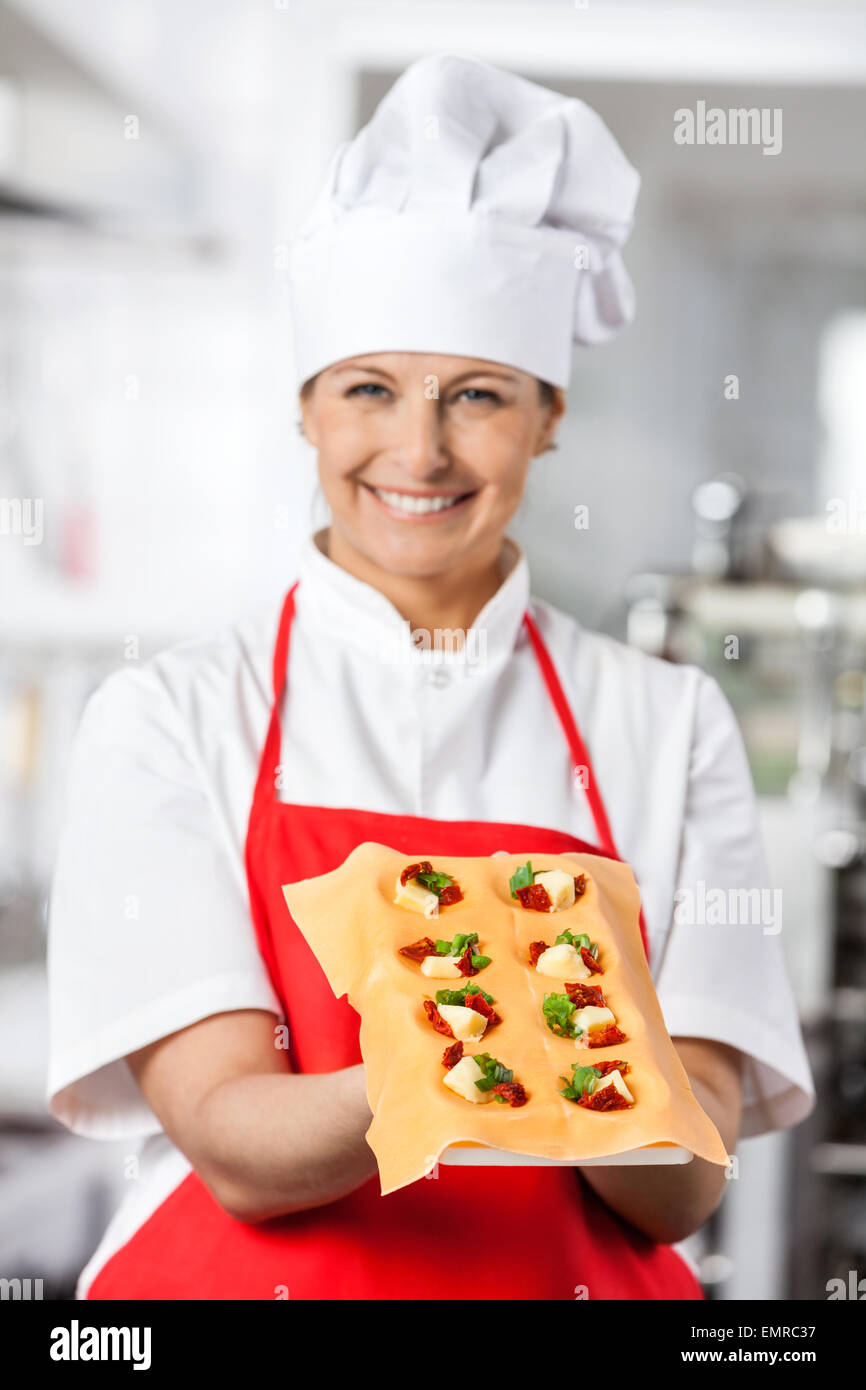 Beautiful Chef Presenting Tray With Stuffed Pasta Sheet Stock Photo - Alamy
