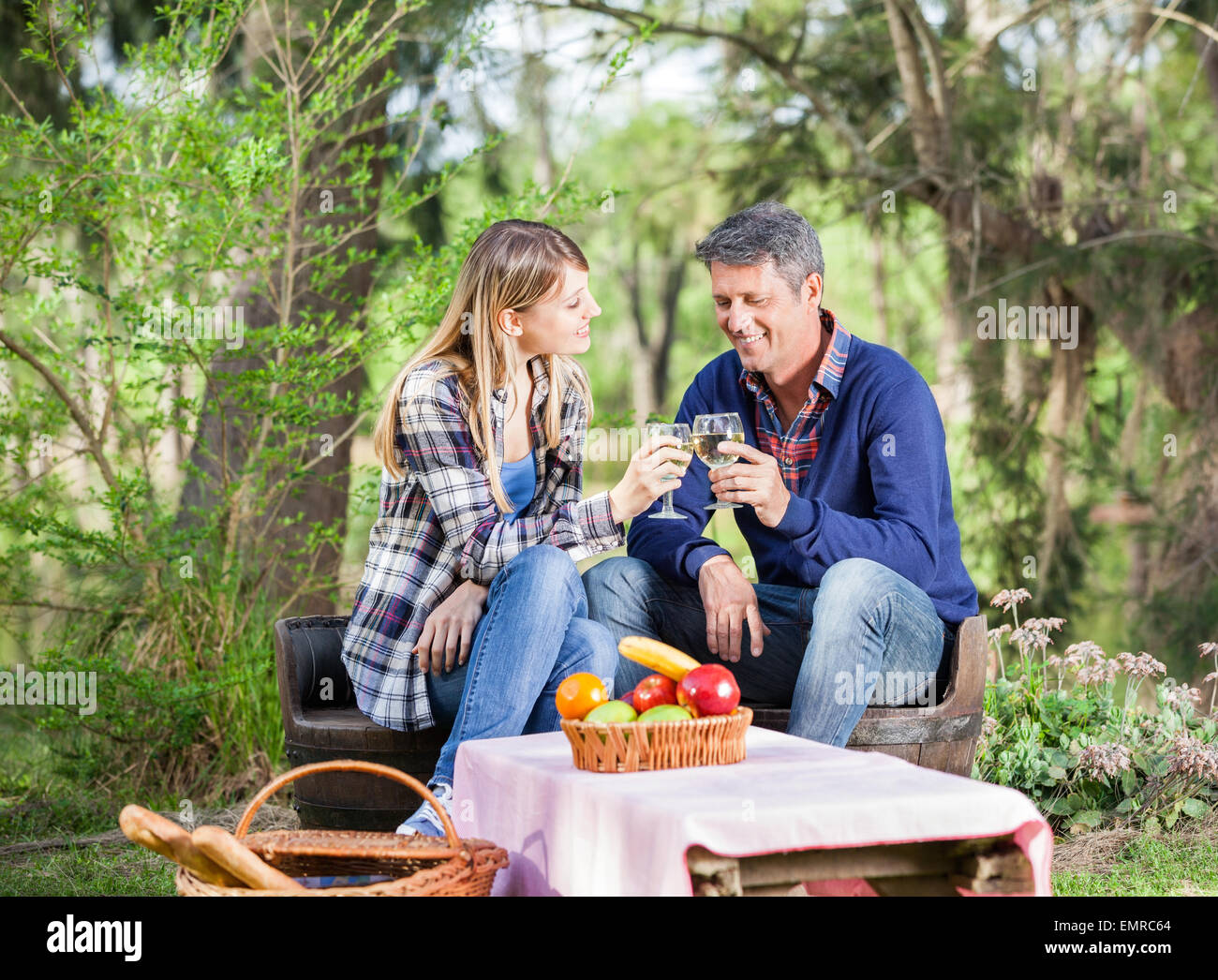 Couple Toasting Wine Glasses At Campsite Stock Photo - Alamy