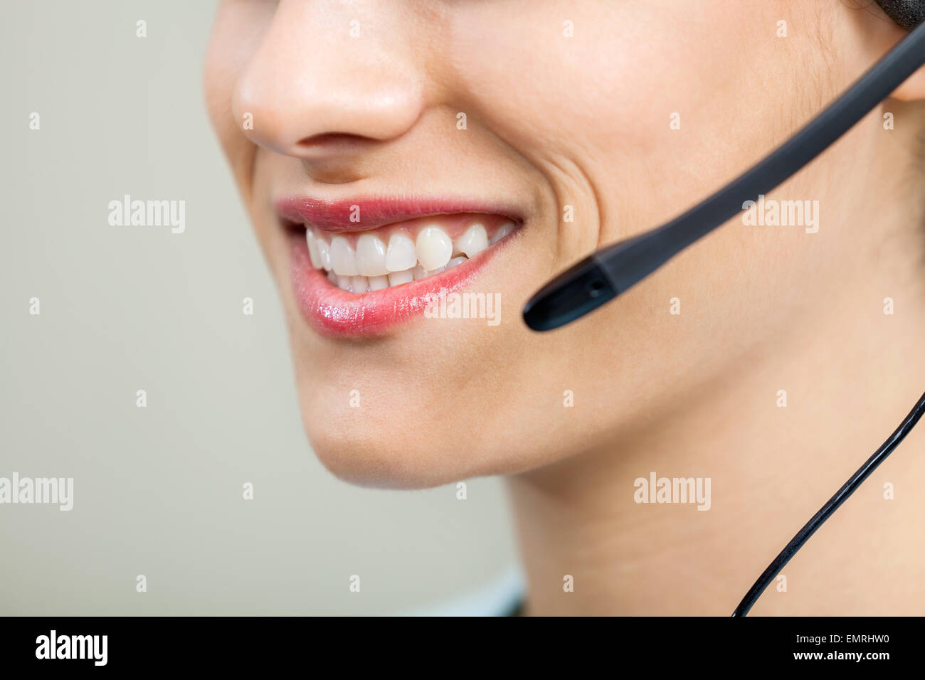 Smiling Female Customer Service Agent Wearing Headset Stock Photo - Alamy