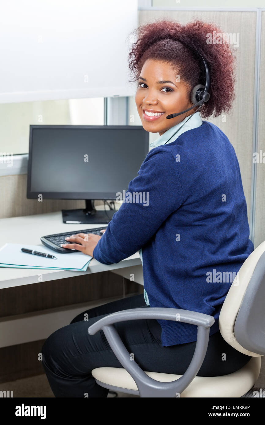 Happy Female Customer Service Executive Using Computer Stock Photo - Alamy