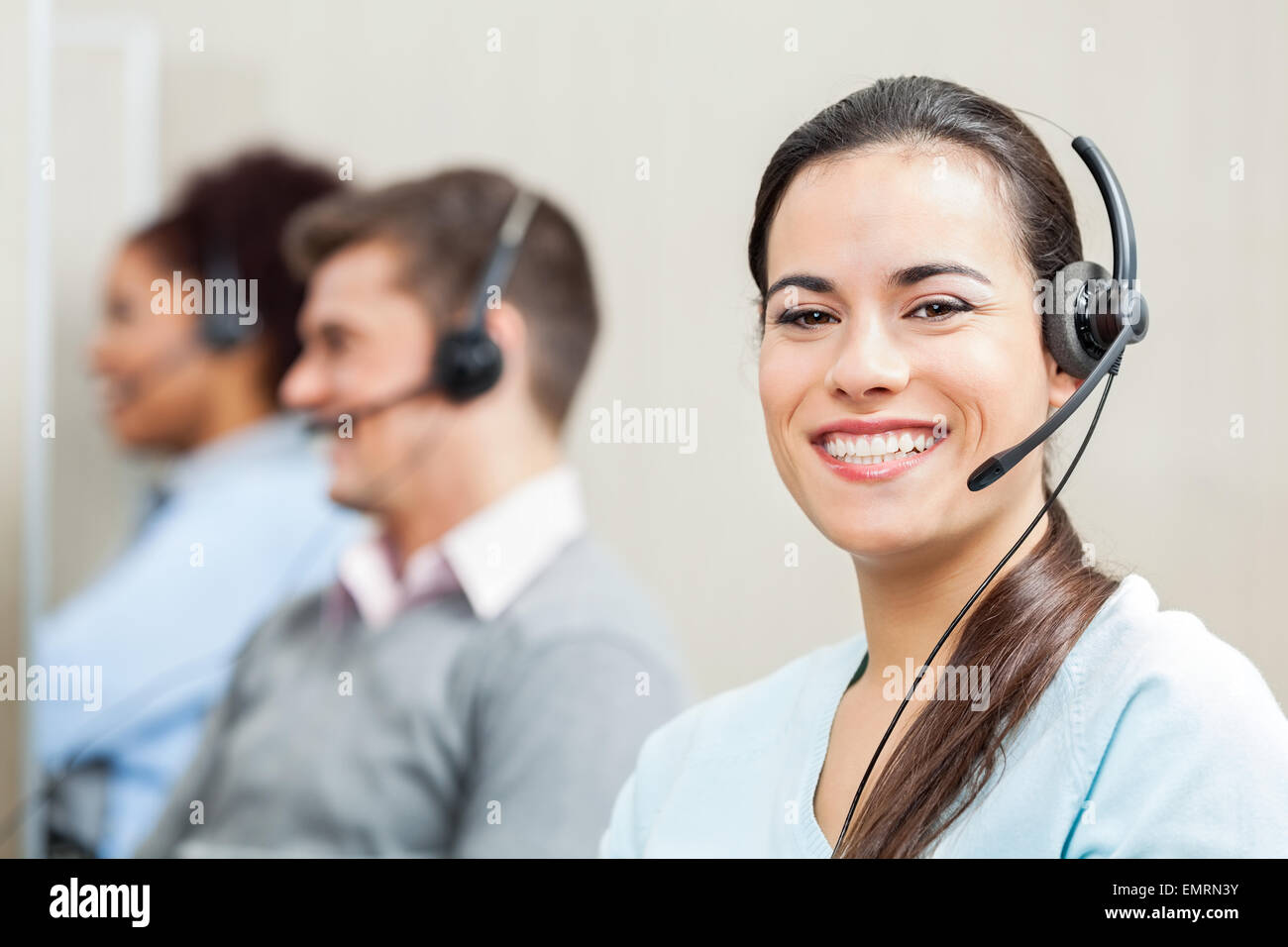 Smiling Female Customer Service Agent In Office Stock Photo - Alamy