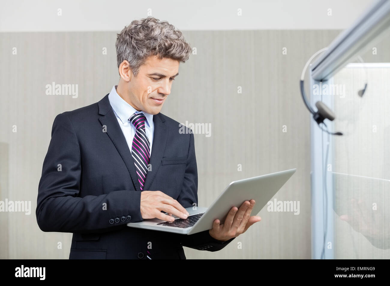 Business Executive Using Laptop Stock Photo - Alamy