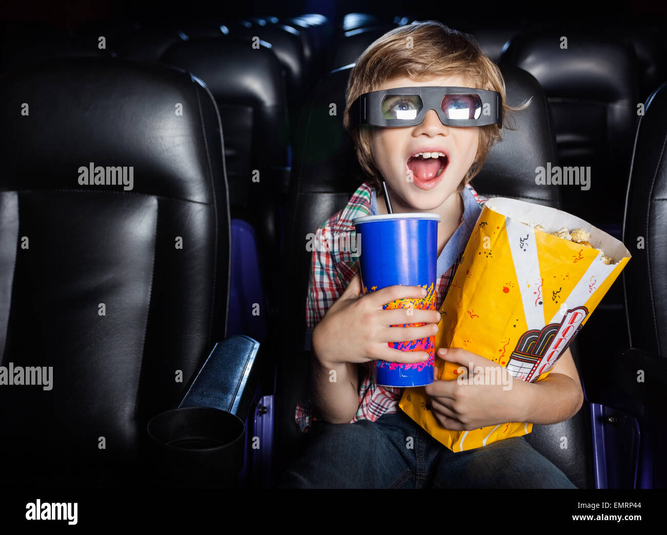 Surprised Boy Watching 3D Movie In Theater Stock Photo - Alamy