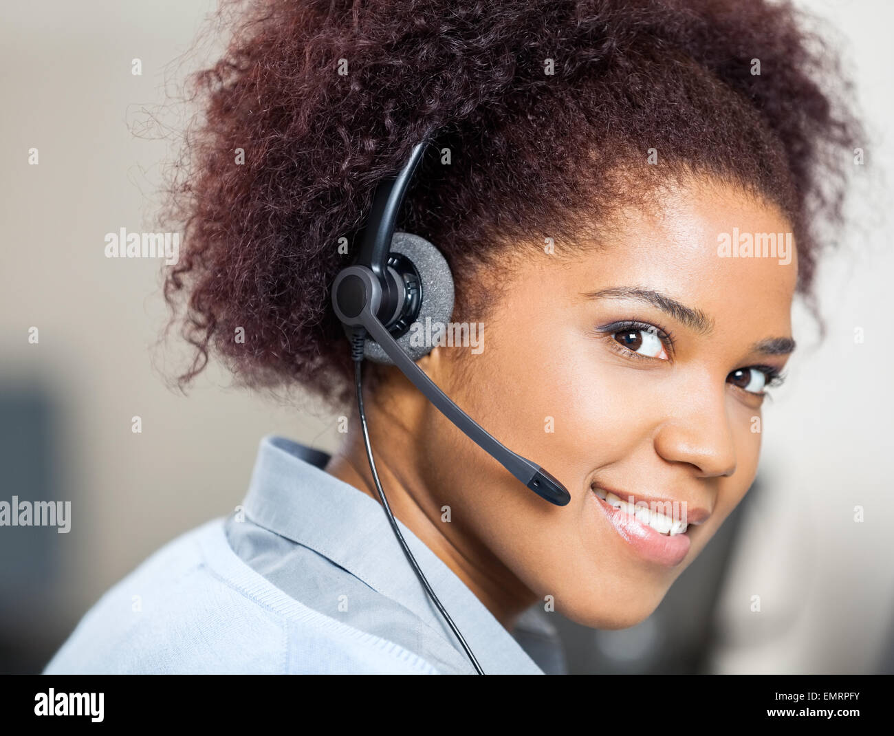 Confident Female Customer Service Agent Wearing Headset At Desk Stock ...