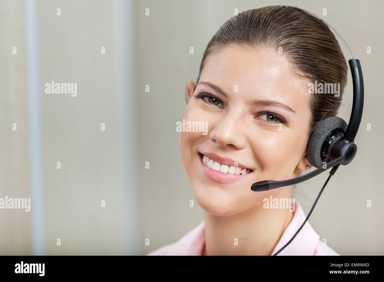 Smiling Female Customer Service Representative Wearing Headset Stock Photo - Alamy