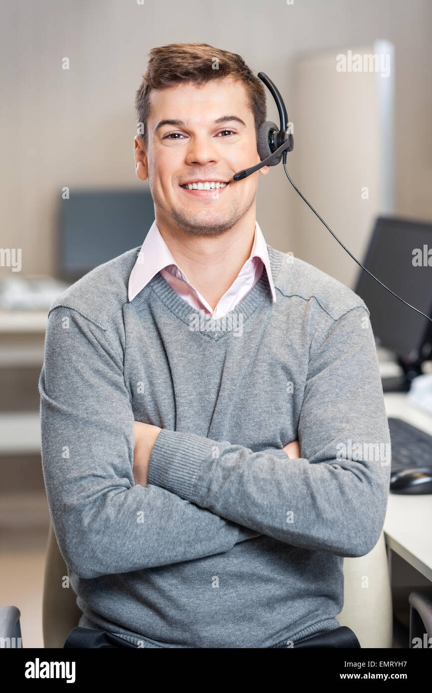 Confident Customer Service Representative Sitting In Office Stock Photo ...