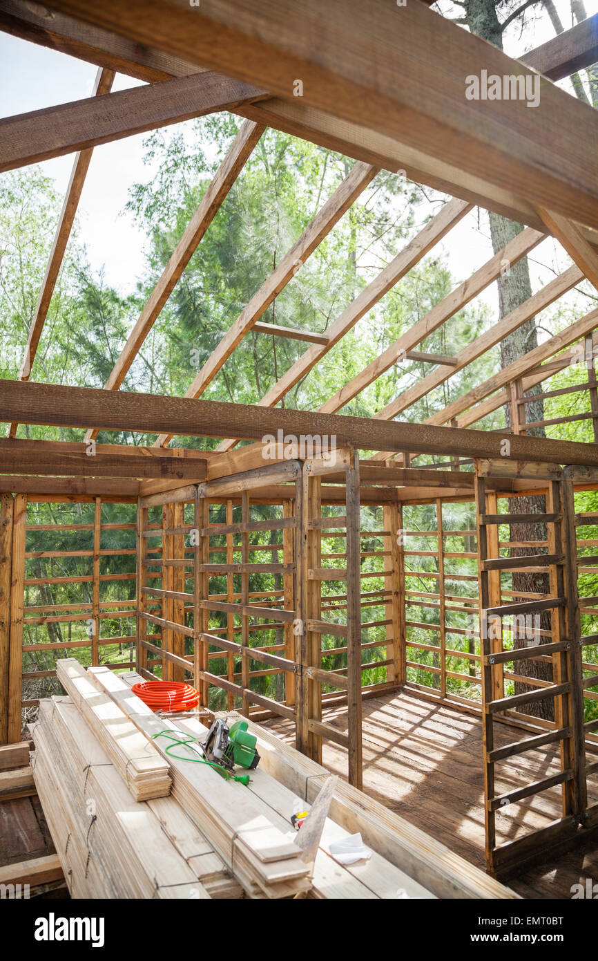 Stacked Wooden Planks In Incomplete Timber Cabin Stock Photo - Alamy