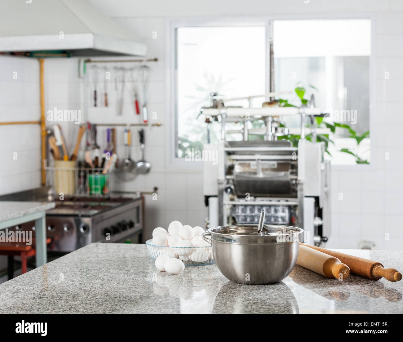 Mixing Bowl With Eggs And Rolling Pin In Commercial Kitchen Stock Photo ...
