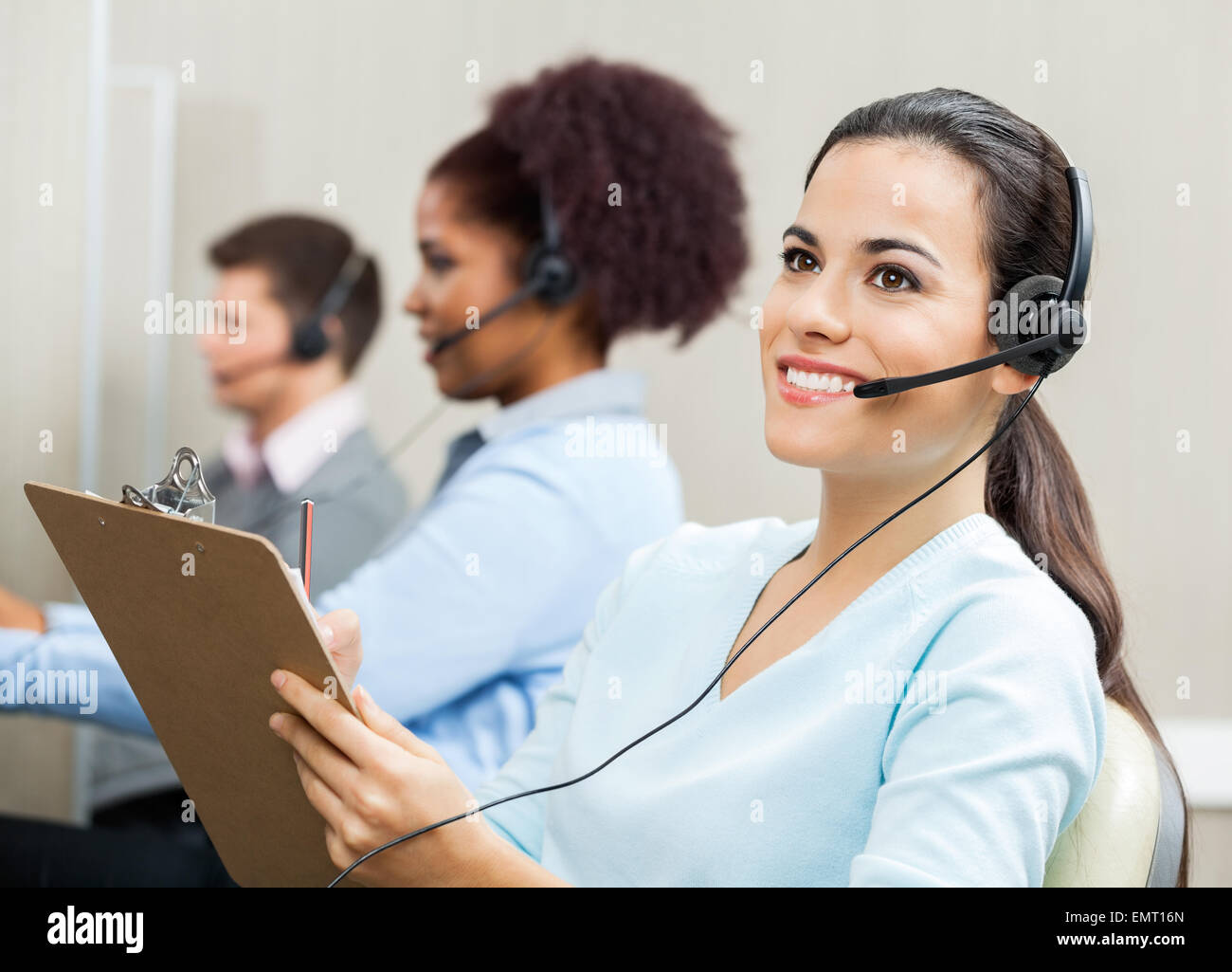 Thoughtful Female Customer Service Representative In Office Stock Photo ...
