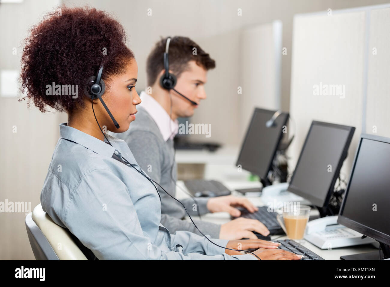 Customer Service Representatives Working In Call Center Stock Photo - Alamy