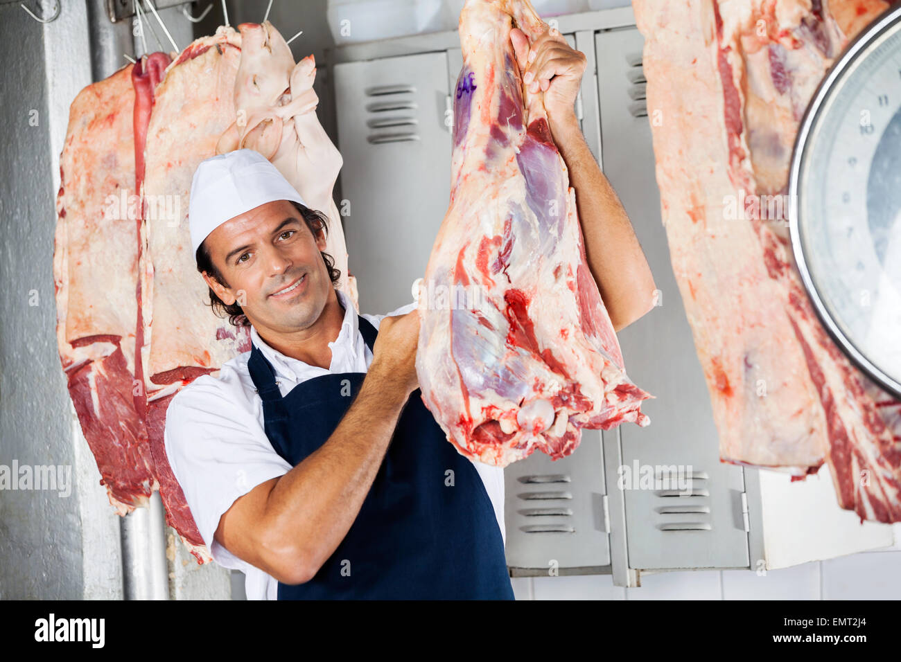 Confident Male Butcher Holding Raw Meat Stock Photo - Alamy
