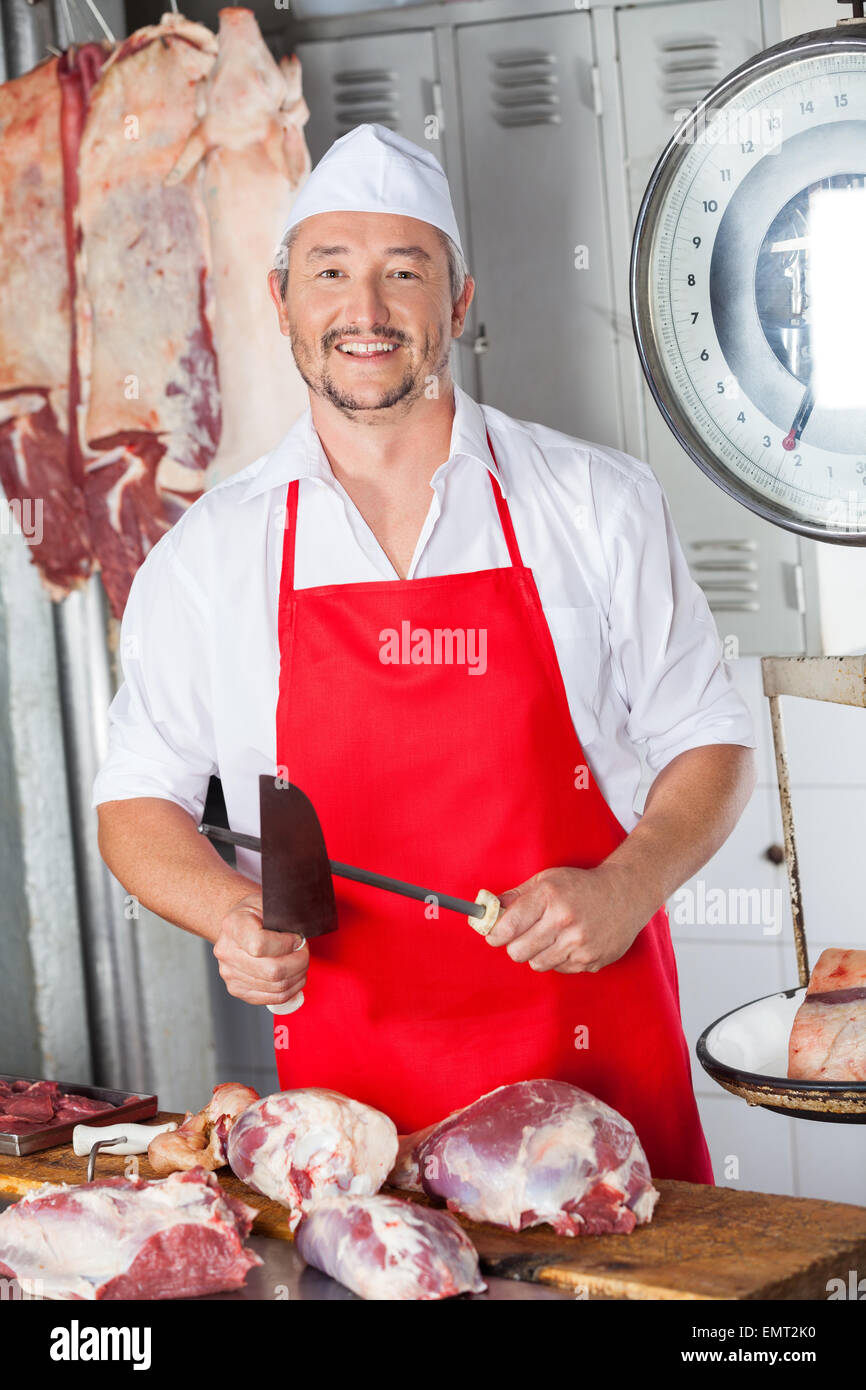 Butcher Sharpening Knife In Butchery Stock Photo - Alamy
