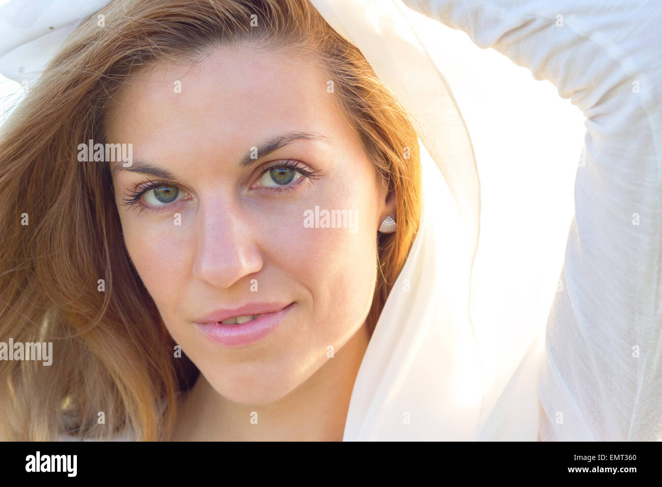 young woman face closeup sunlight light girl Stock Photo - Alamy