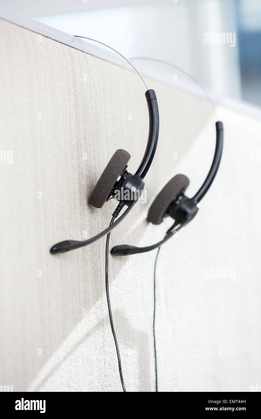 Headphones Hanging On Cubicle Partition Stock Photo - Alamy